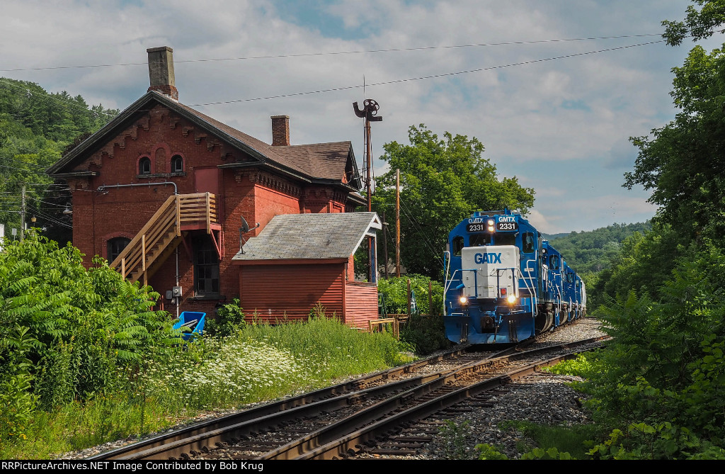GMTX 2331 leads northbound VTR detour freight past the ex-CV depot in Bethel